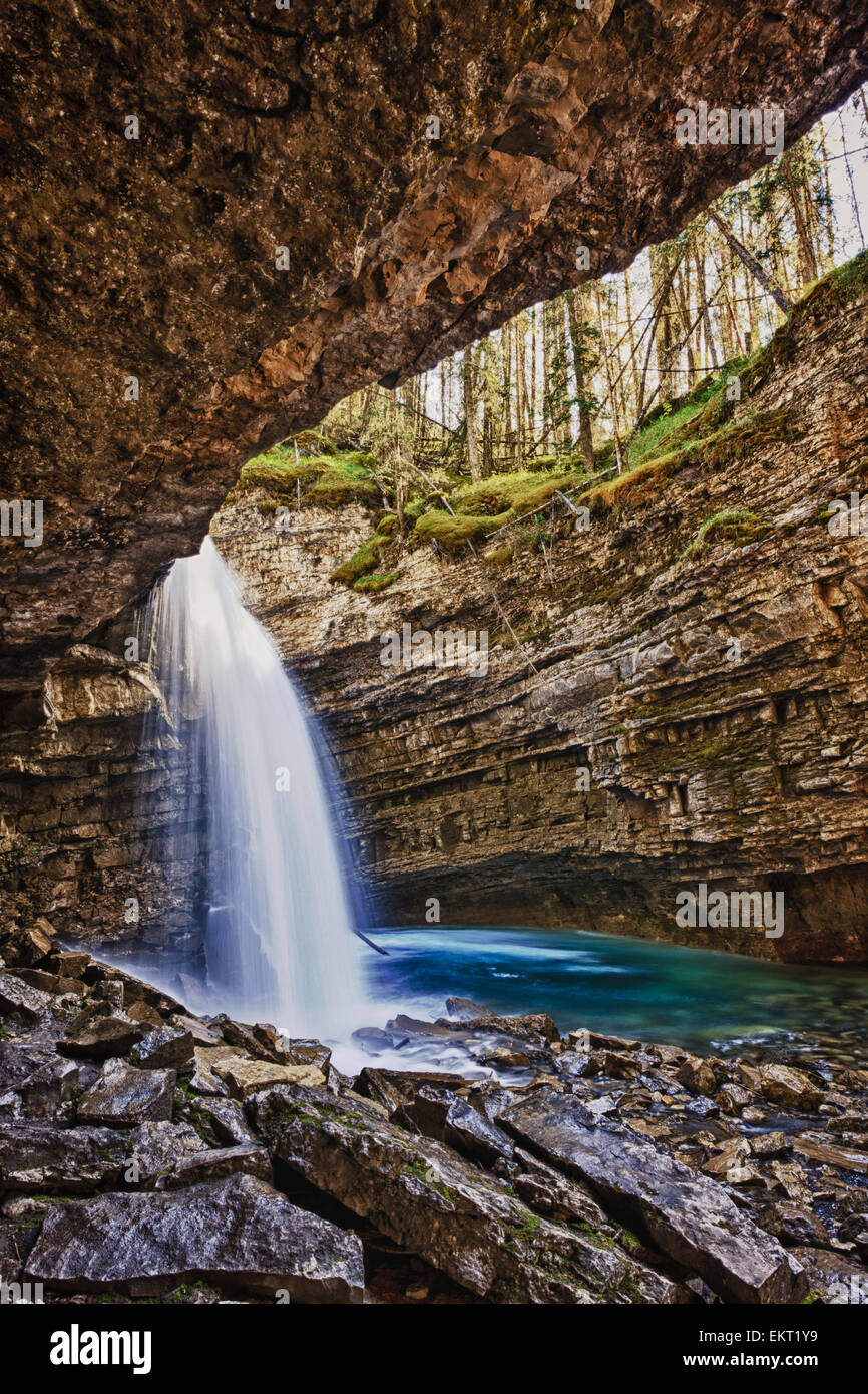 A River Cascades Over A Small Waterfall In Johnston Canyon In Banff ...