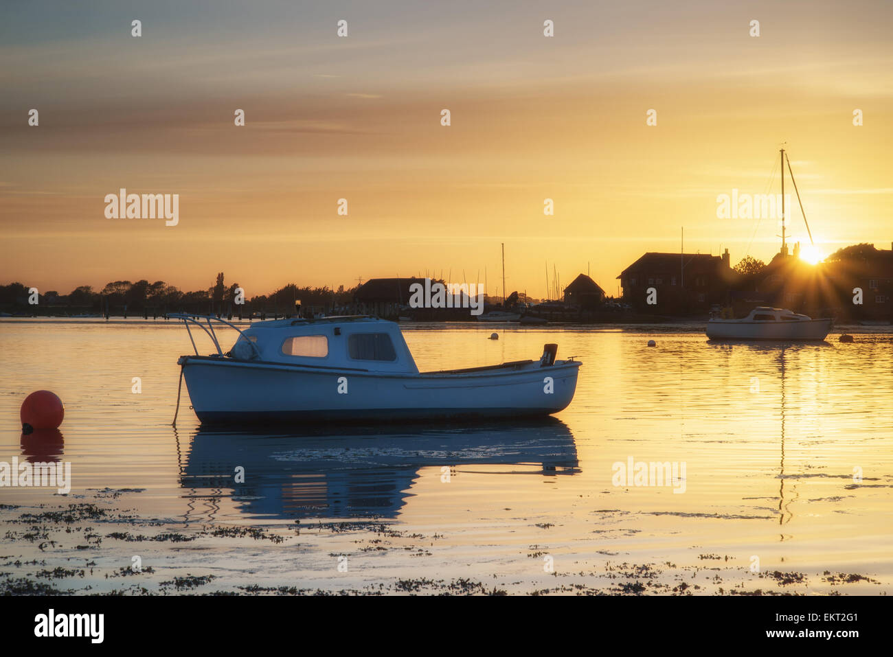 Beautiful Summer sunset landscape over low tide harbor with boats Stock ...
