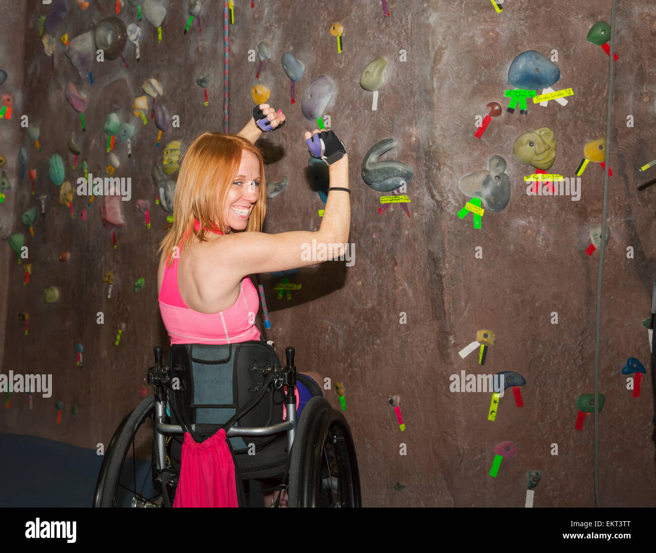 Woman with spinal cord injury rock climbing; Edmonton, Alberta, Canada ...