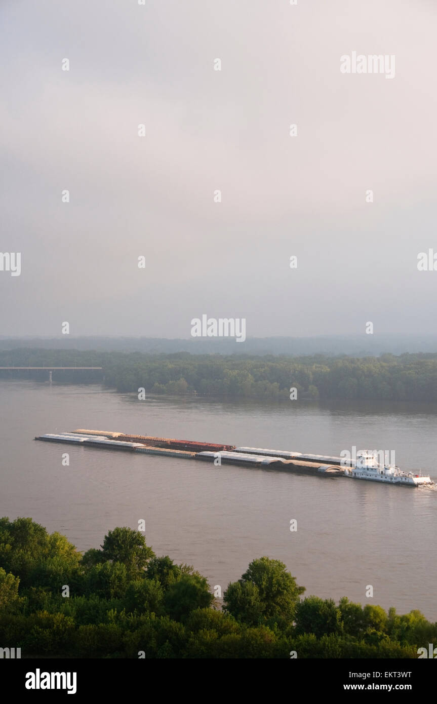 Agriculture - Grain barge navigating the Mississippi River early on an ...