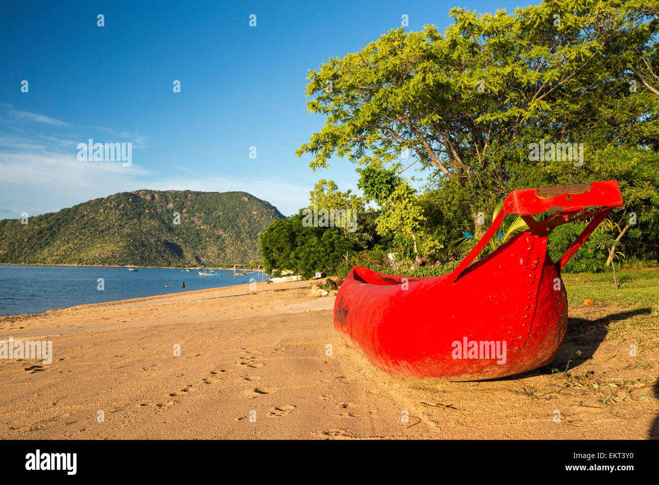 A traditional dug out canoe on a beach at Cape Maclear on the shores of ...