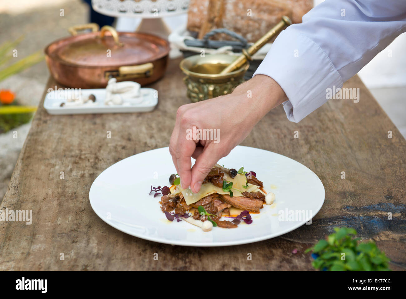Chef putting the finishing touches Stock Photo - Alamy