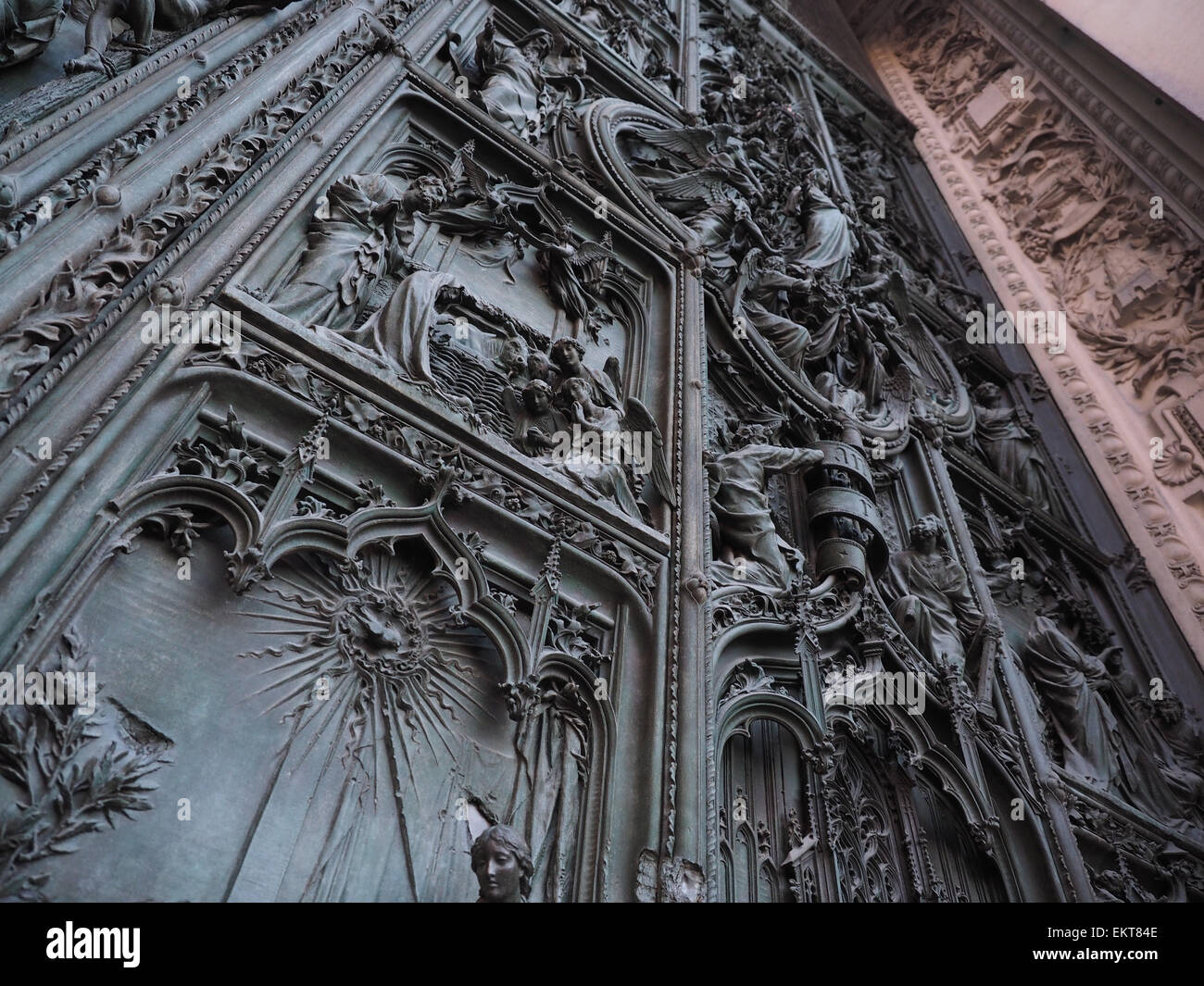 Relief on milan cathedral door italy hi-res stock photography and ...