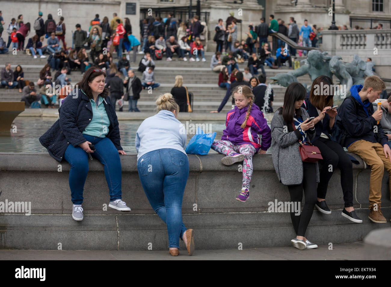 People visiting the sights in the capital gather in Trafalgar Square on ...