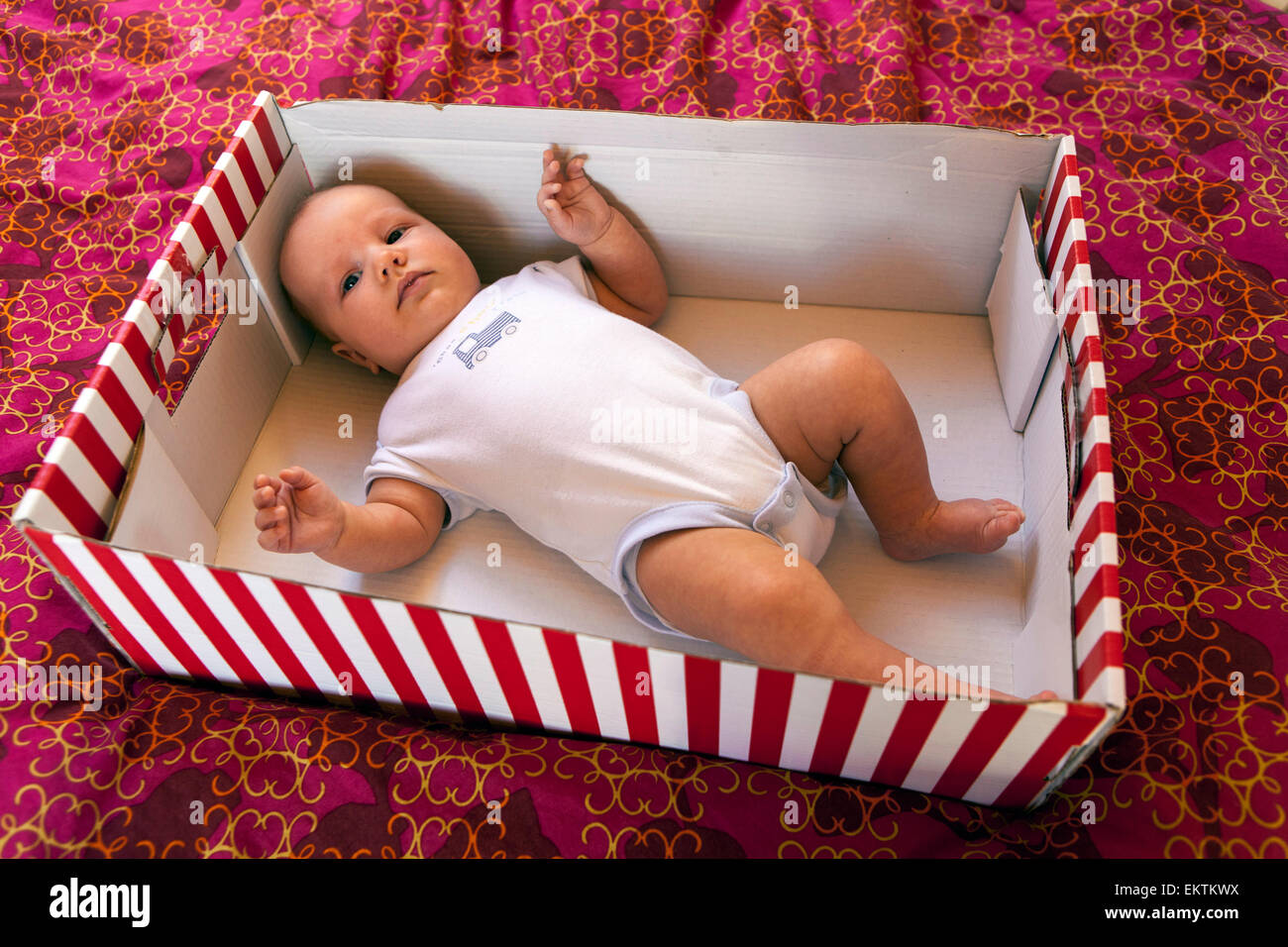 Child in a box hi-res stock photography and images - Alamy