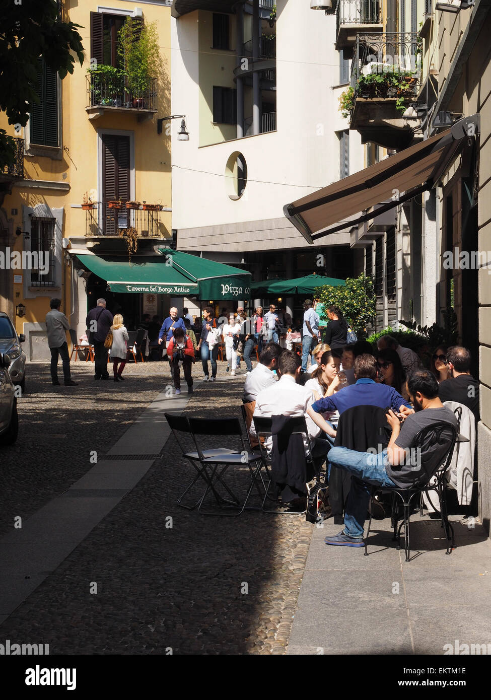 People sitting outside a cafe, Brera distict, Milan, Lombardy, Italy ...