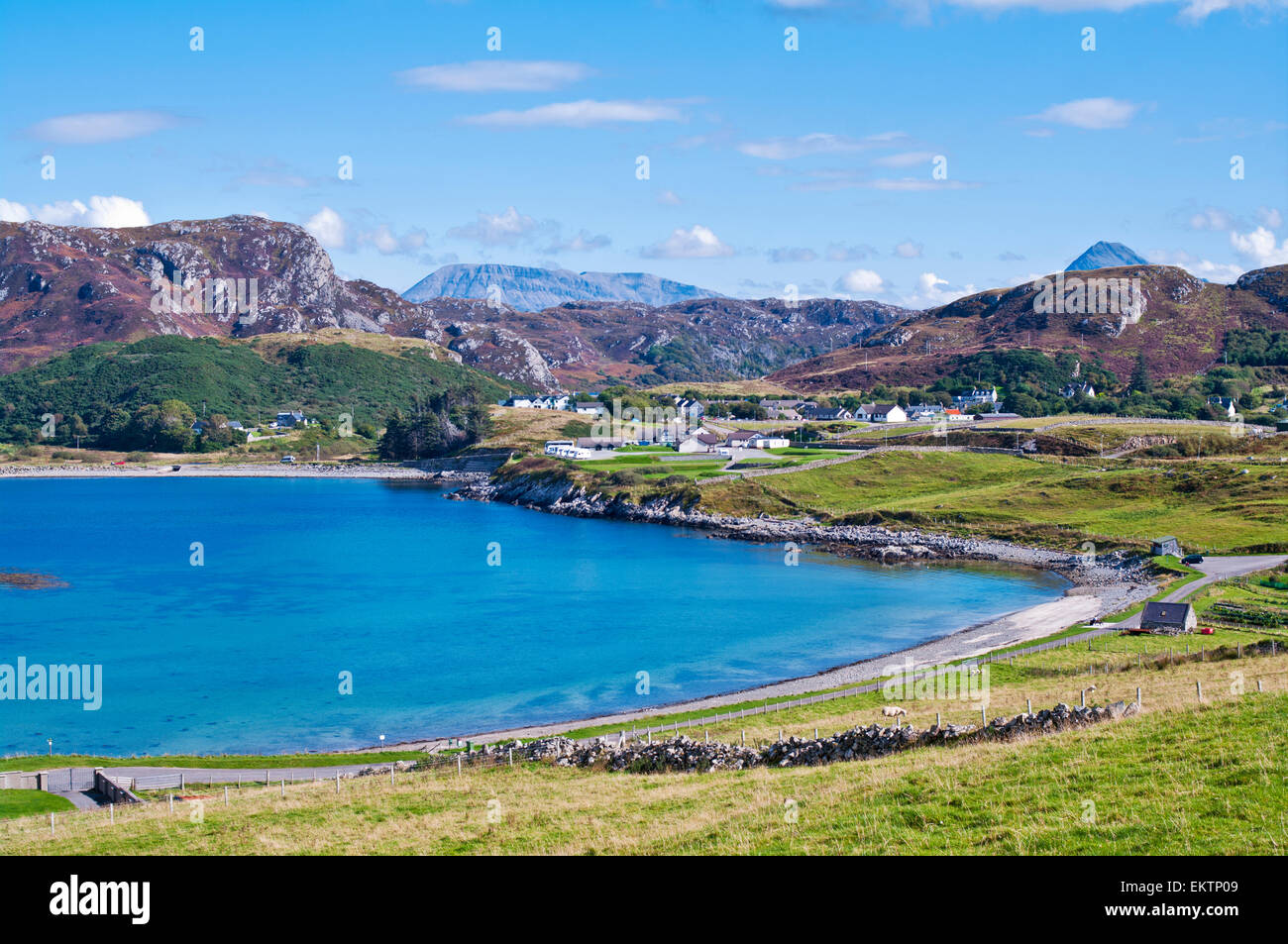 Scourie Bay at high tide, waterfront caravan site and village on the ...
