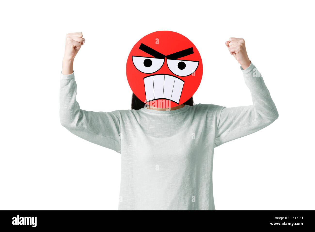 Young woman with a angry emoticon face in front of her face Stock Photo ...