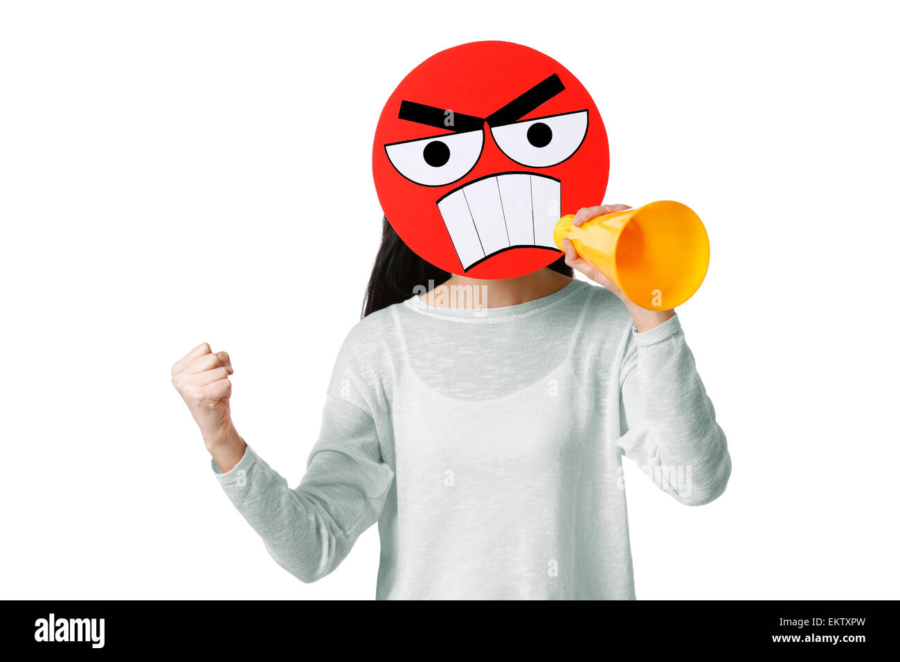 Young woman shouting with a angry emoticon face in front of her face ...