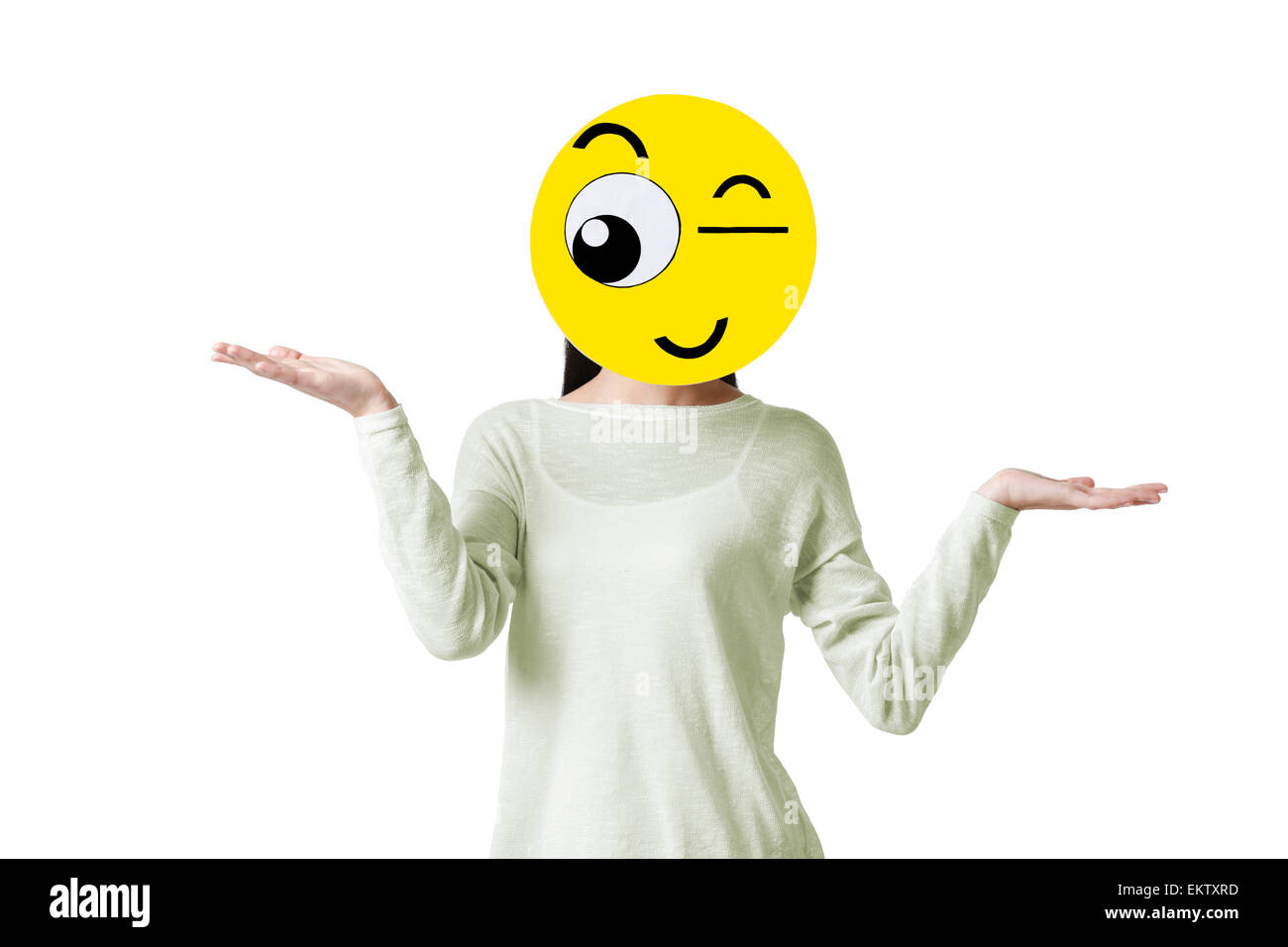 Young woman with a winking emoticon face in front of her face Stock ...