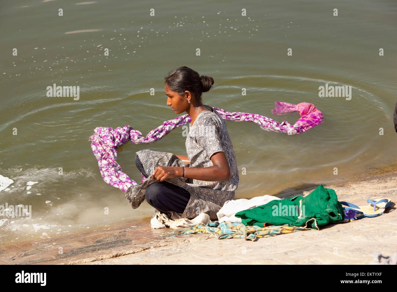 Young Woman Washing Clothes In The River High Resolution Stock ...