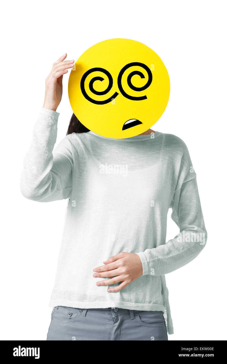 Young woman with a dizzy emoticon face in front of her face Stock Photo ...