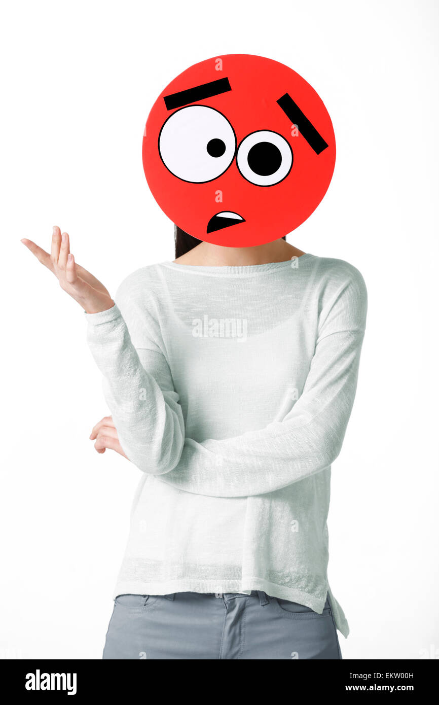 Young woman with a confused emoticon face in front of her face Stock ...