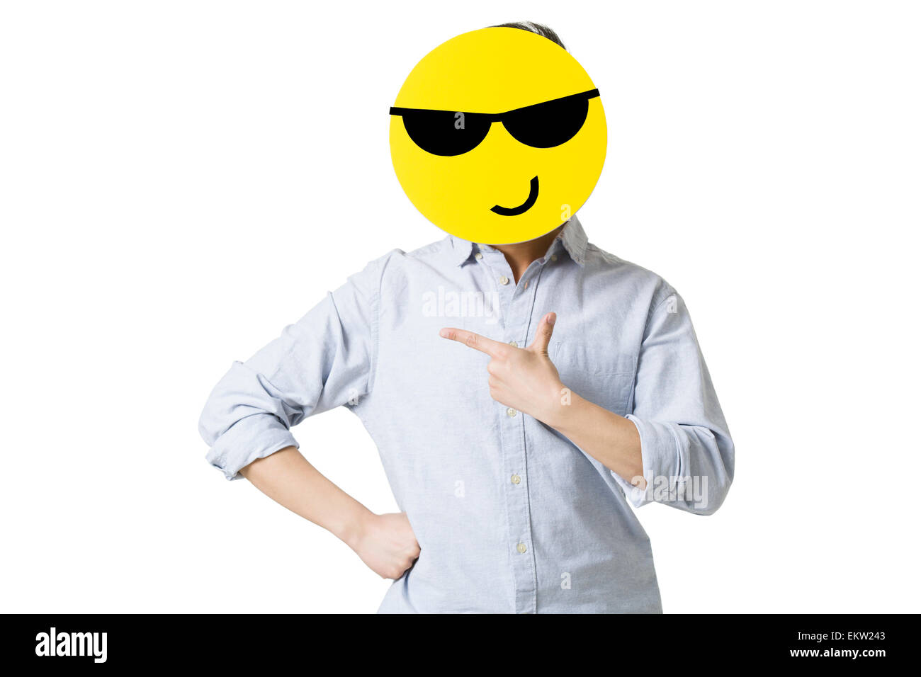 Young man with a cool emoticon face in front of his face Stock Photo ...