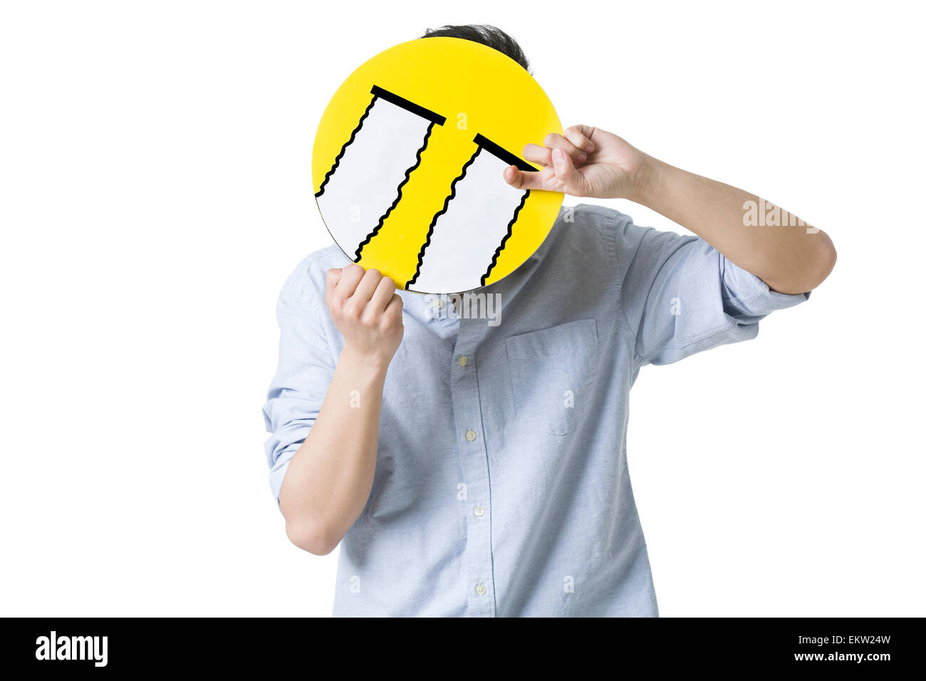 Young man with a crying emoticon face in front of his face Stock Photo ...