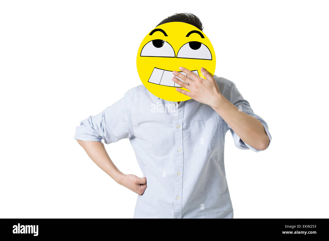 Young man with a happy emoticon face in front of his face Stock Photo ...