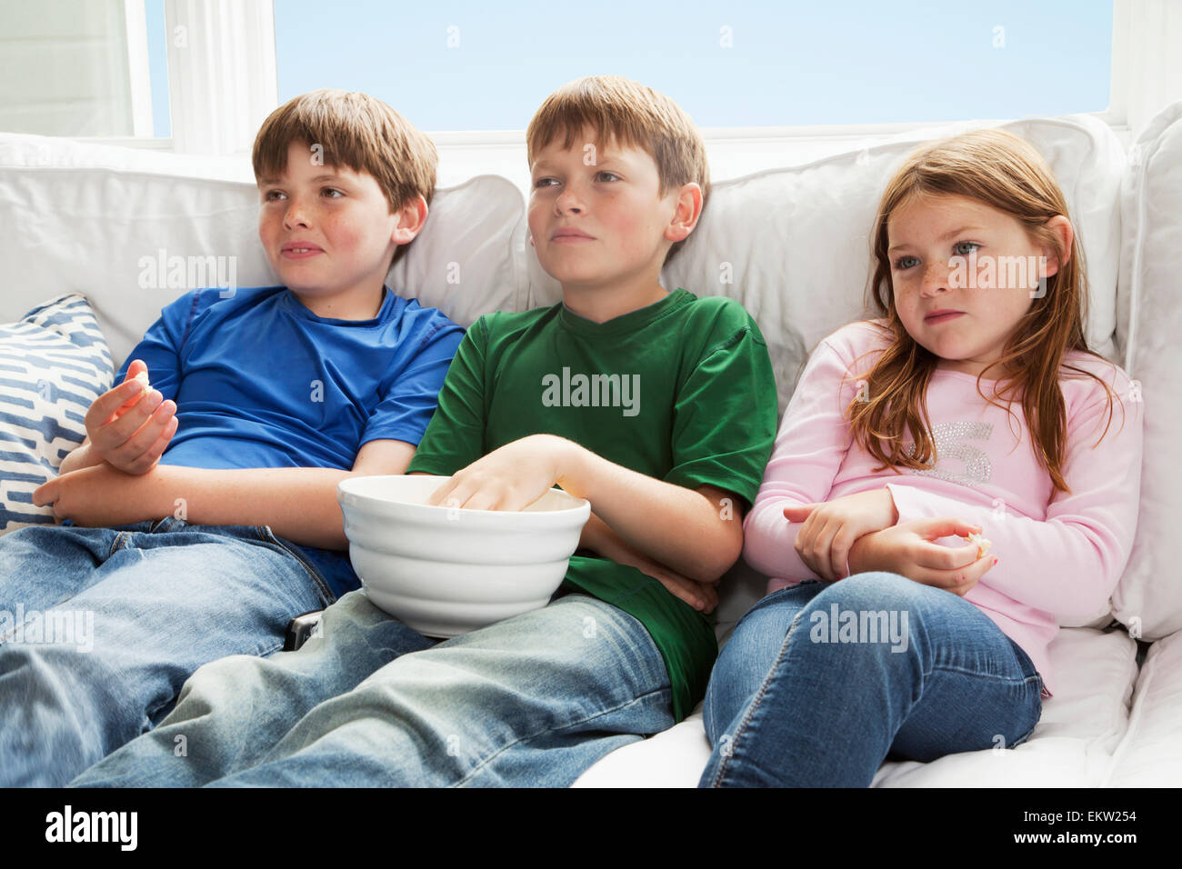 Three Children Sitting On A Couch Presumably Watching Tv; San Francisco ...