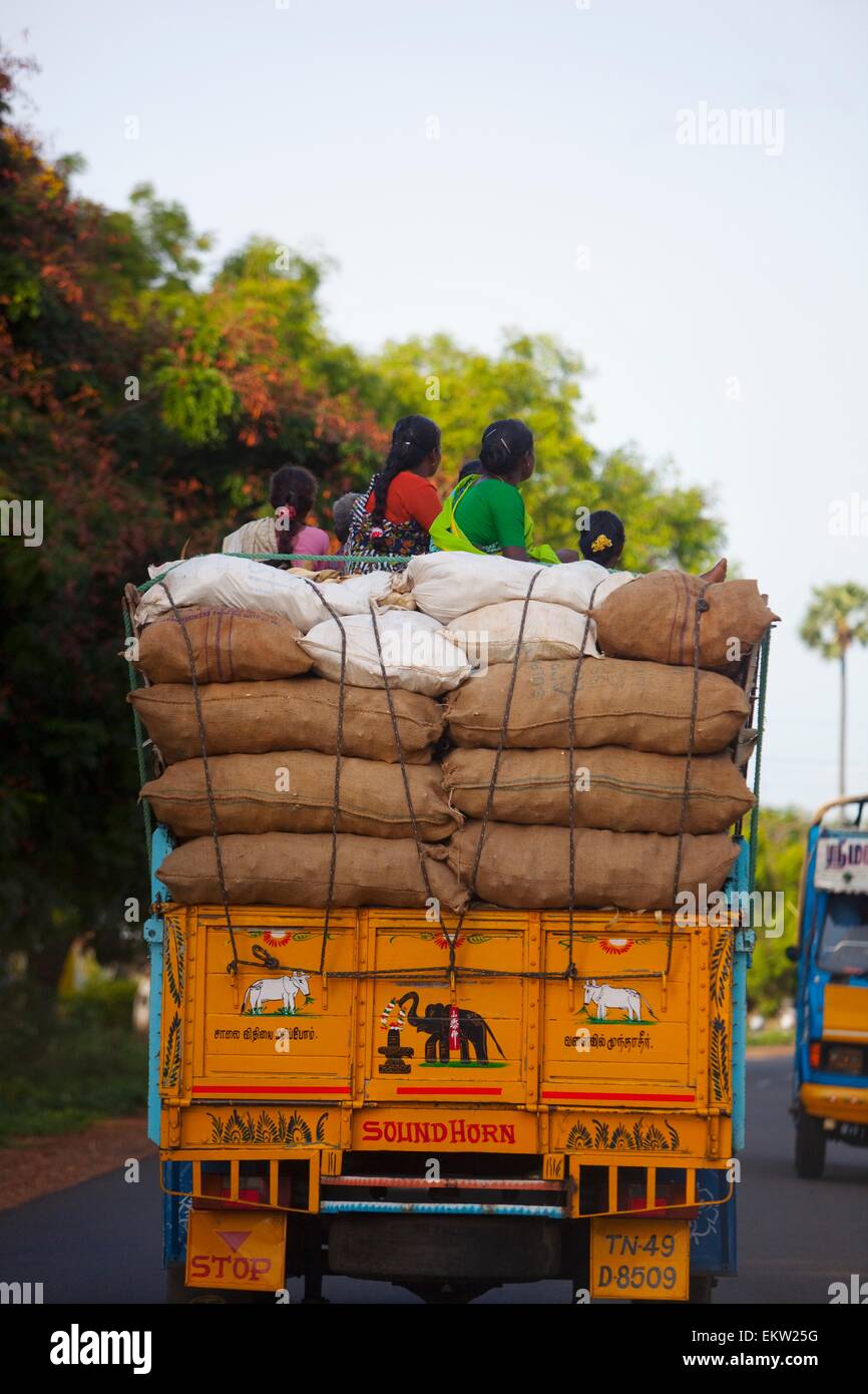 Children Riding On Top Of A Truck Loaded With Sacks For Delivery ...