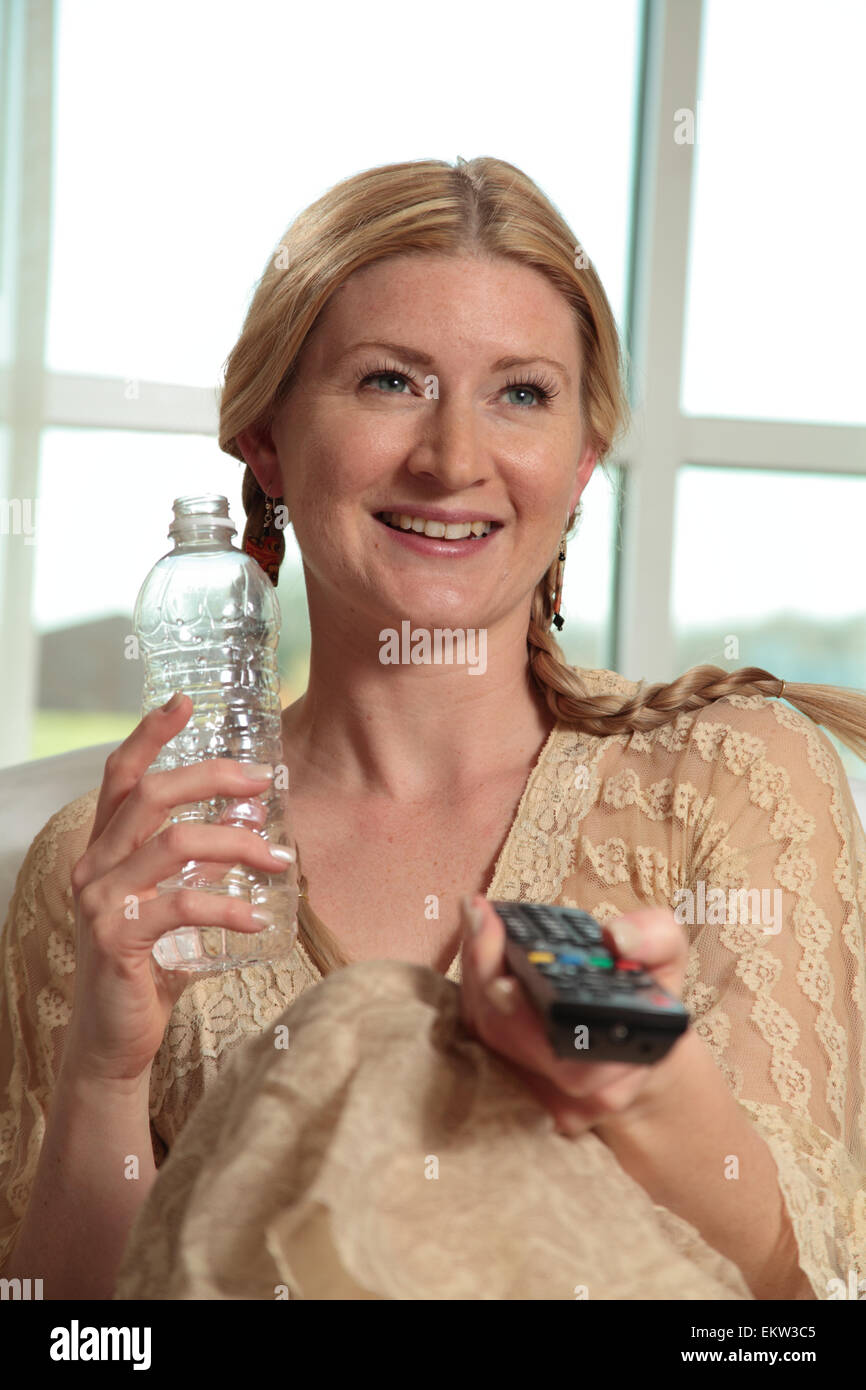 woman watching TV Stock Photo - Alamy