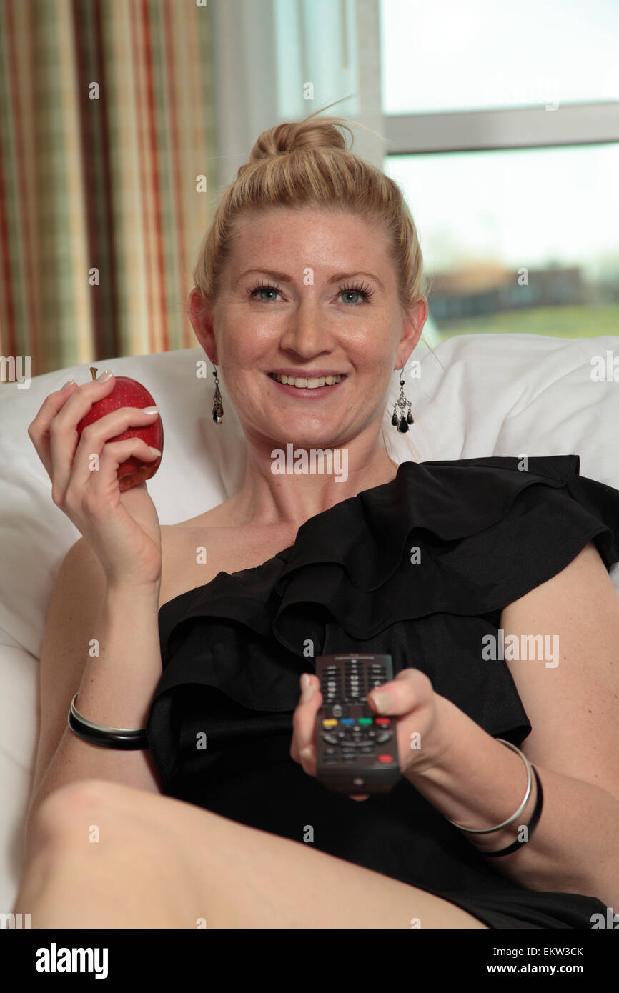 woman watching TV Stock Photo - Alamy