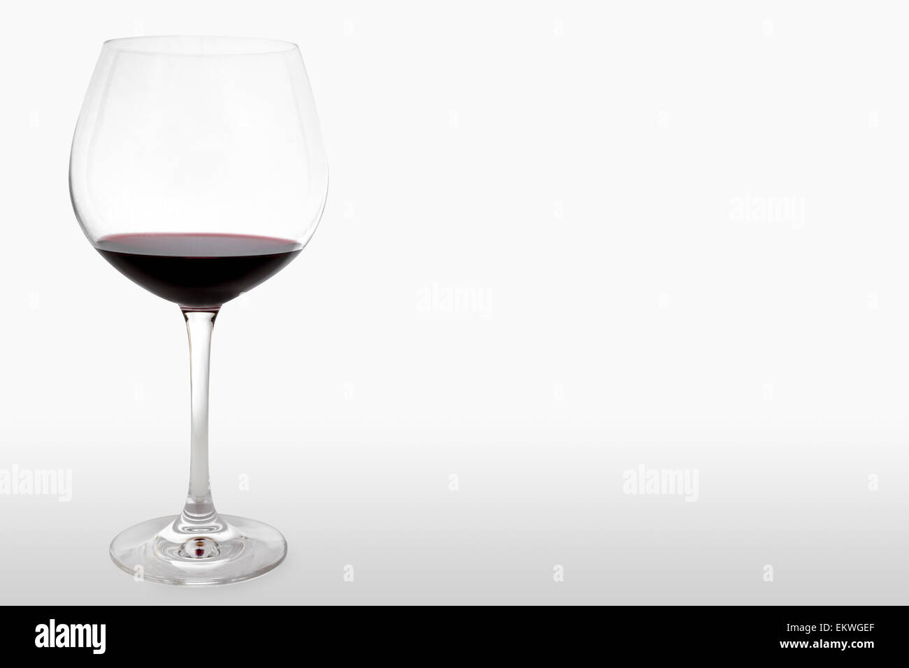 Horizontal shot of a glass of red wine on white background Stock Photo ...