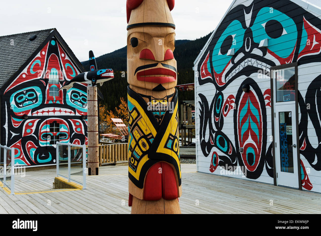 Native styled buildings and totem pole in the Carcross commons ...