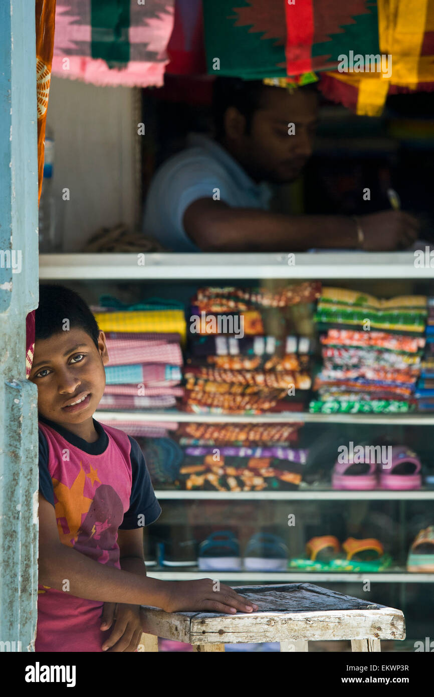 A Man And Boy Inside A Shop Selling Clothing; Sylhet, Bangladesh Stock ...