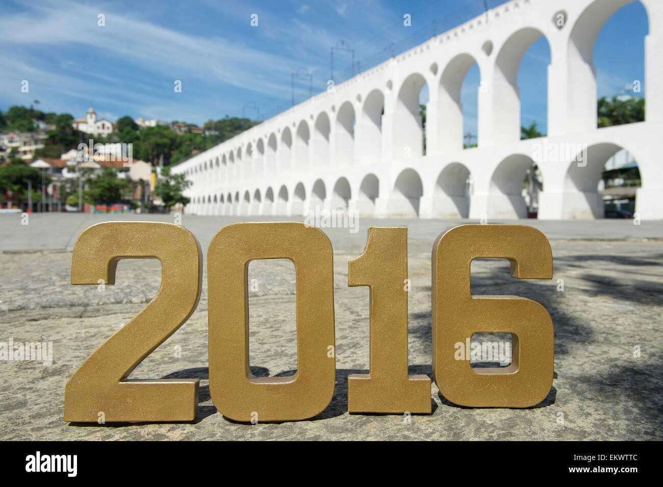 Golden Rio 2016 sign standing in the plaza in front of the famous Arcos ...