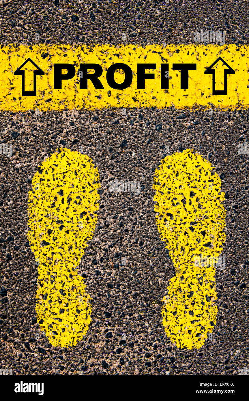 Profit message. Conceptual image with yellow paint footsteps on the ...