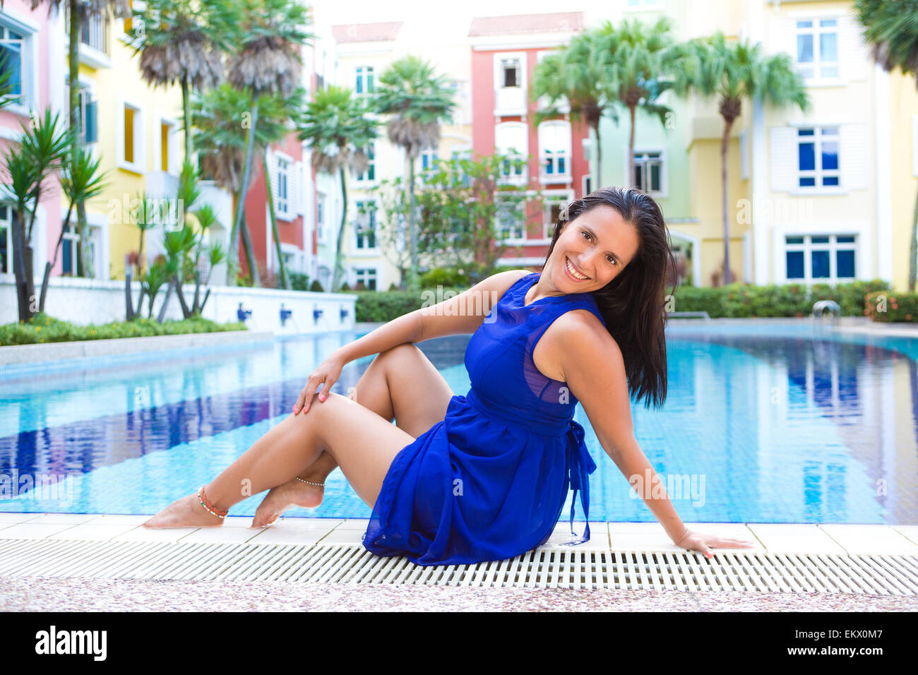 Pretty woman by the swimming pool Stock Photo - Alamy