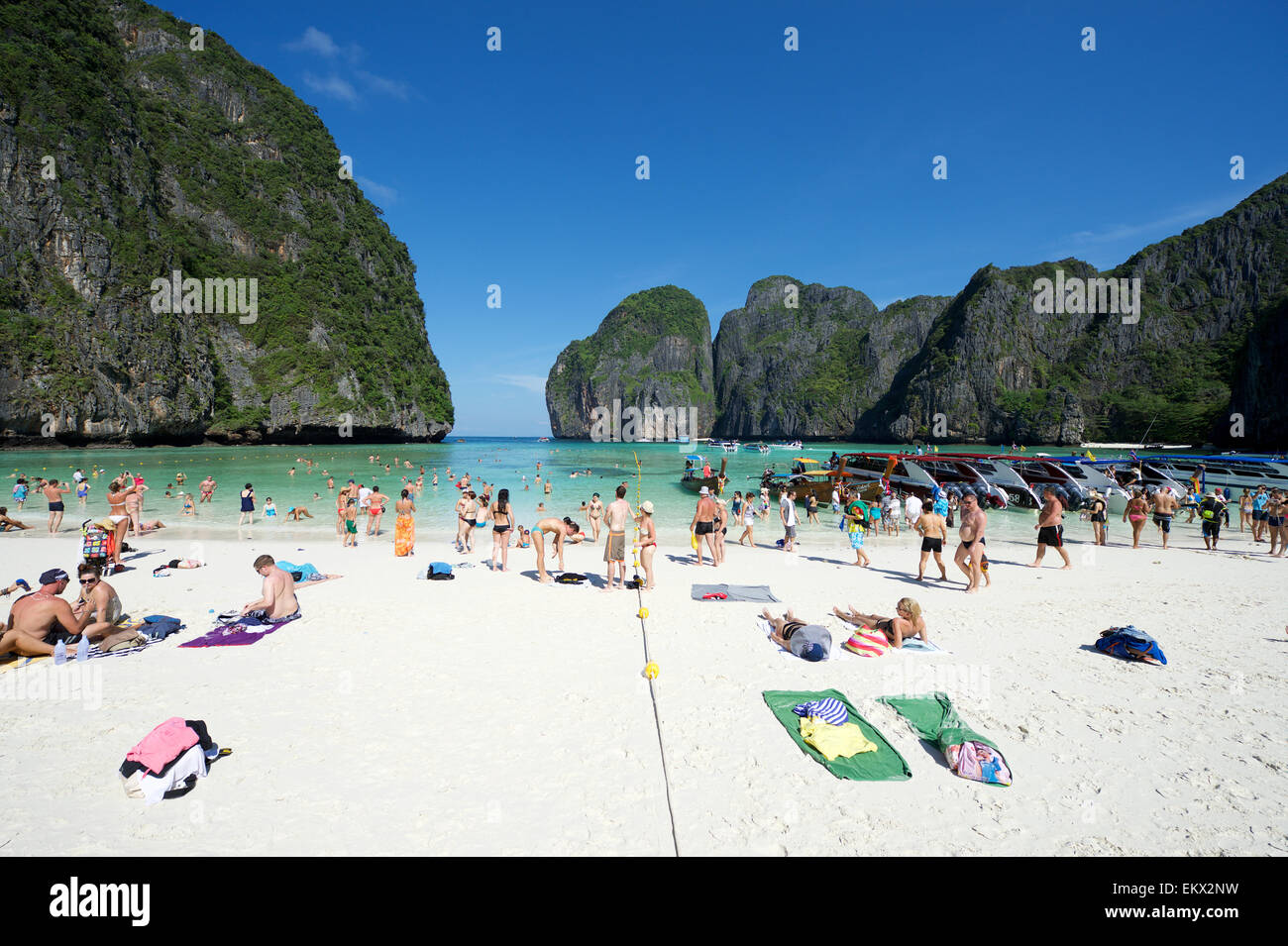 MAYA BAY, THAILAND - NOVEMBER 12, 2014: Crowds of sunbathing visitors ...