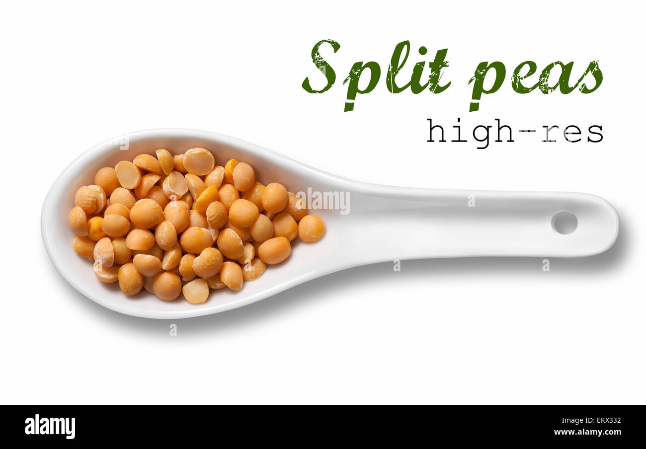 Yellow split peas in white porcelain spoon / high resolution product photography of seed in ...
