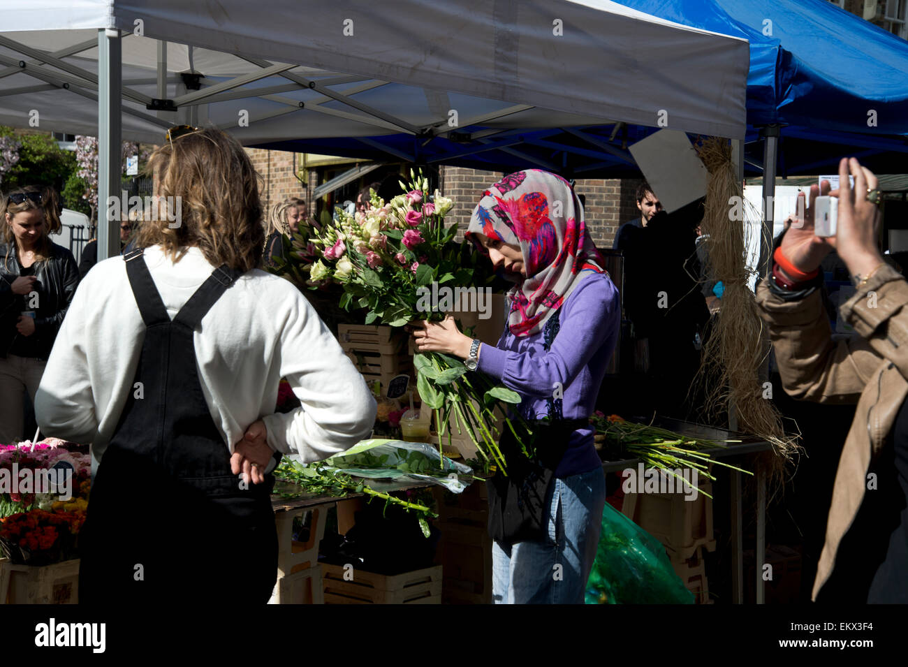 Hackney Spring 2015. Broadway market. Flower stall - making bouquets ...