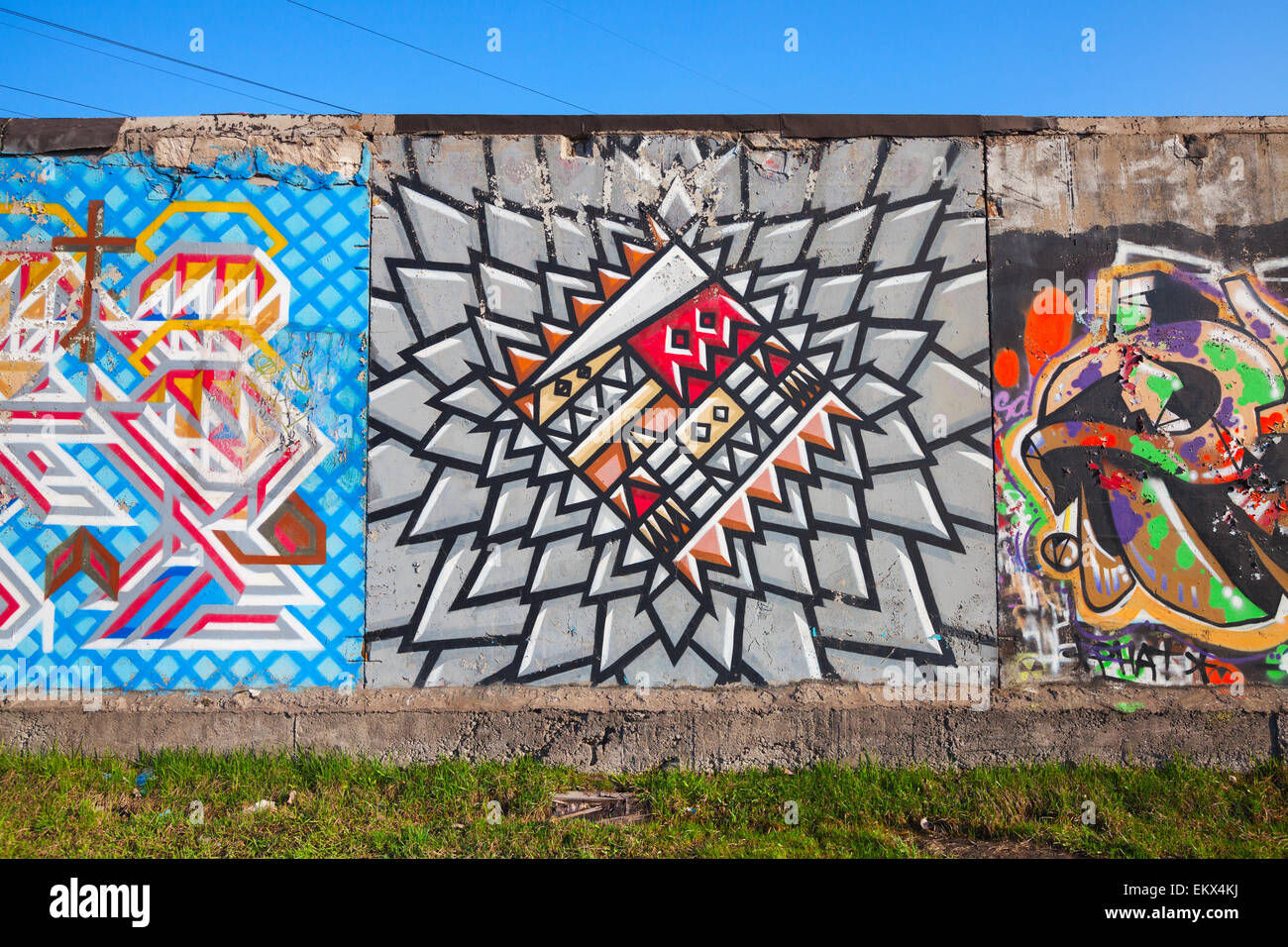 Saint-Petersburg, Russia - April 6, 2015: Colorful graffiti on old gray ...