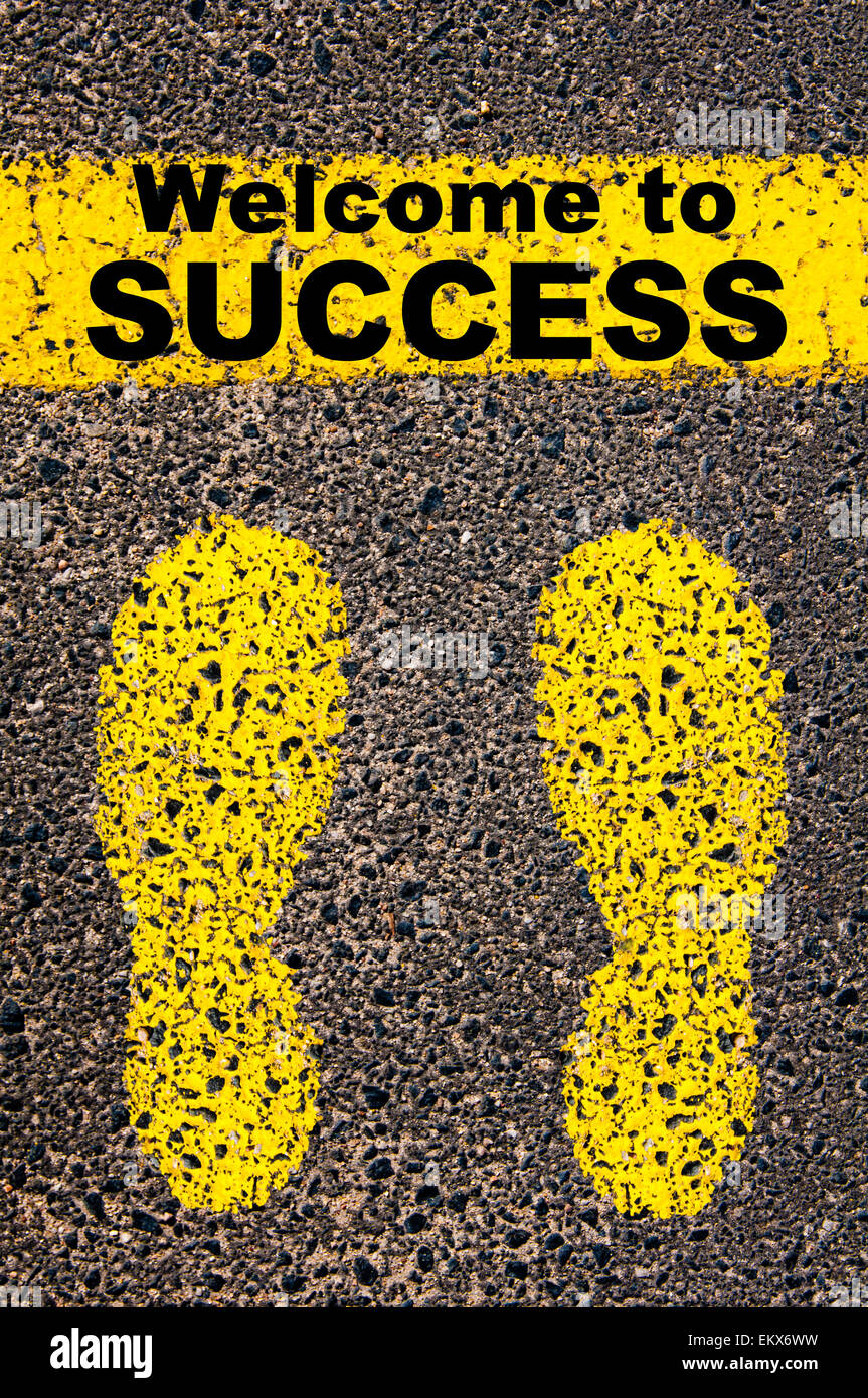 Welcome to Success. Conceptual image with yellow paint footsteps on the ...