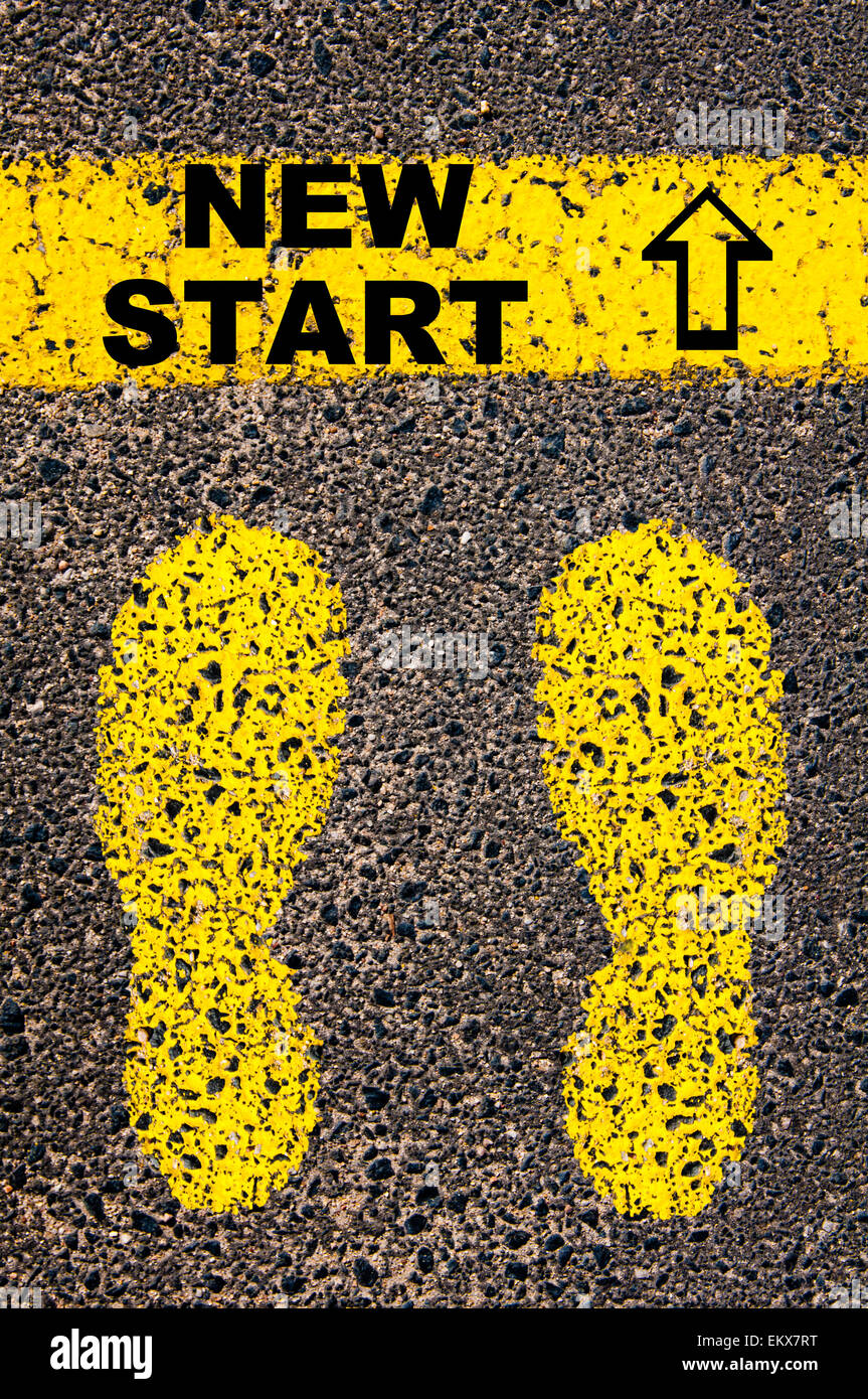 New Start message. Conceptual image with yellow paint footsteps on the ...