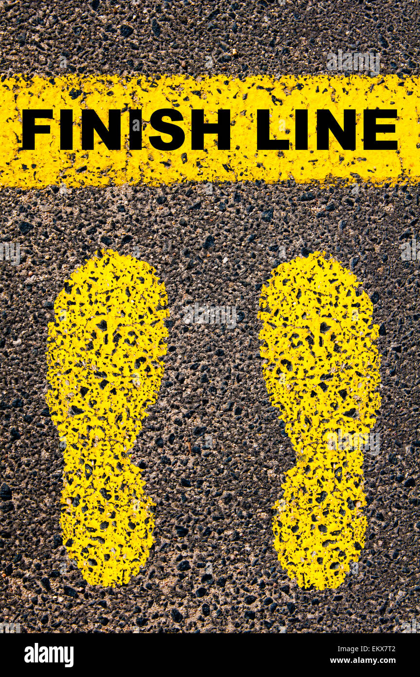 Finish Line message. Conceptual image with yellow paint footsteps on ...