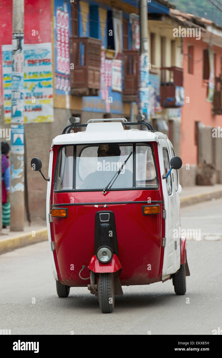 A Motorized Vehicle Traveling Down The Street; Cusco Peru Stock Photo ...