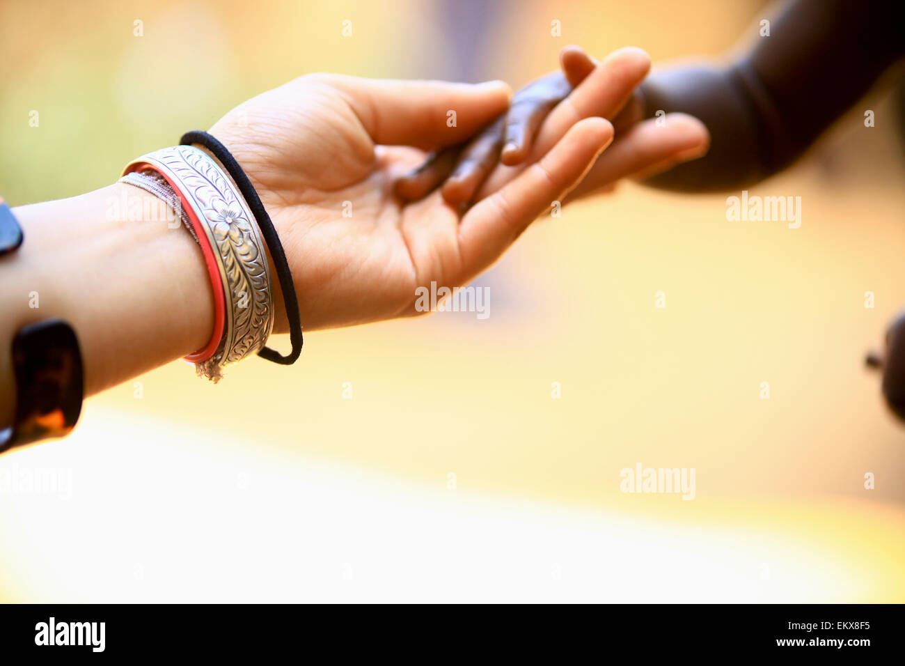 An Child's Hand Resting In An Adult's Hand; Kampala Uganda Africa Stock ...