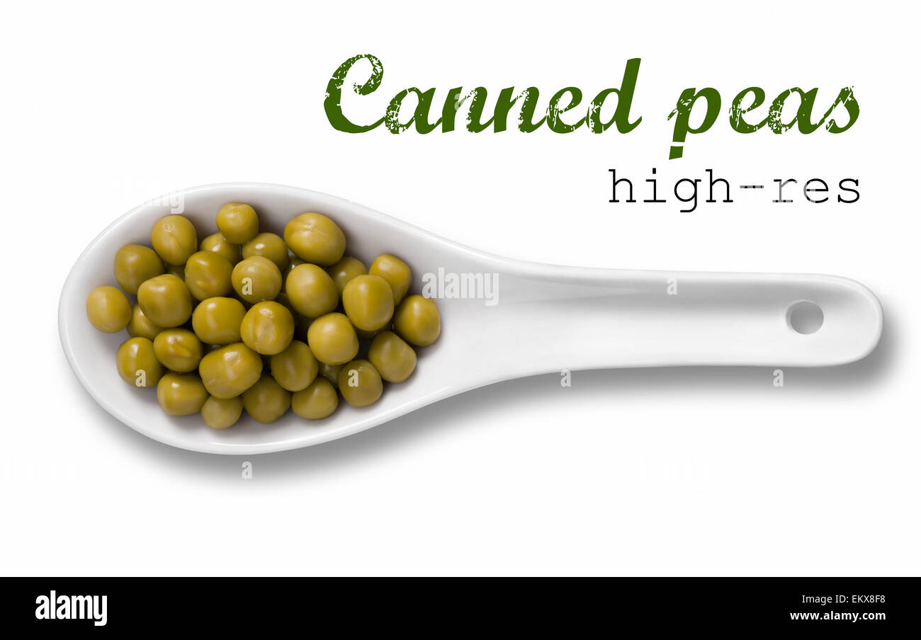 Canned peas in white porcelain spoon / high resolution product photography of seed in white ...
