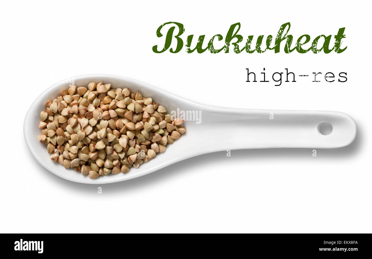 Buckwheat groats in white porcelain spoon / high resolution product photography of seed in white ...