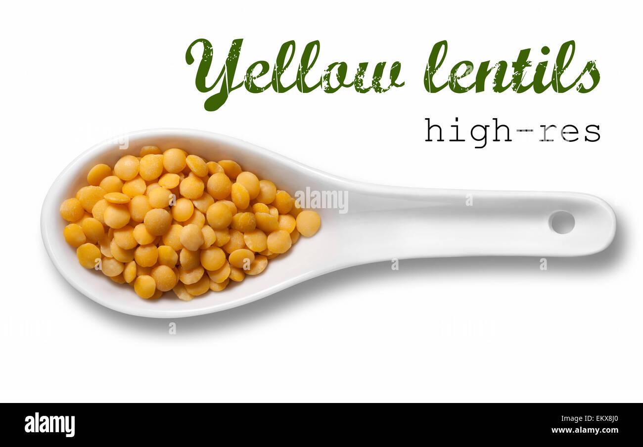 Yellow lentil in white porcelain spoon/ high resolution product photography of seed in white ...