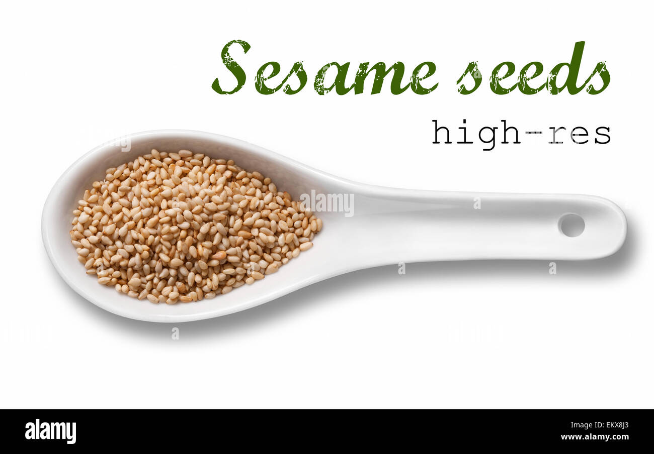 Sesame seeds in a wooden spoon / high resolution product photography of ...