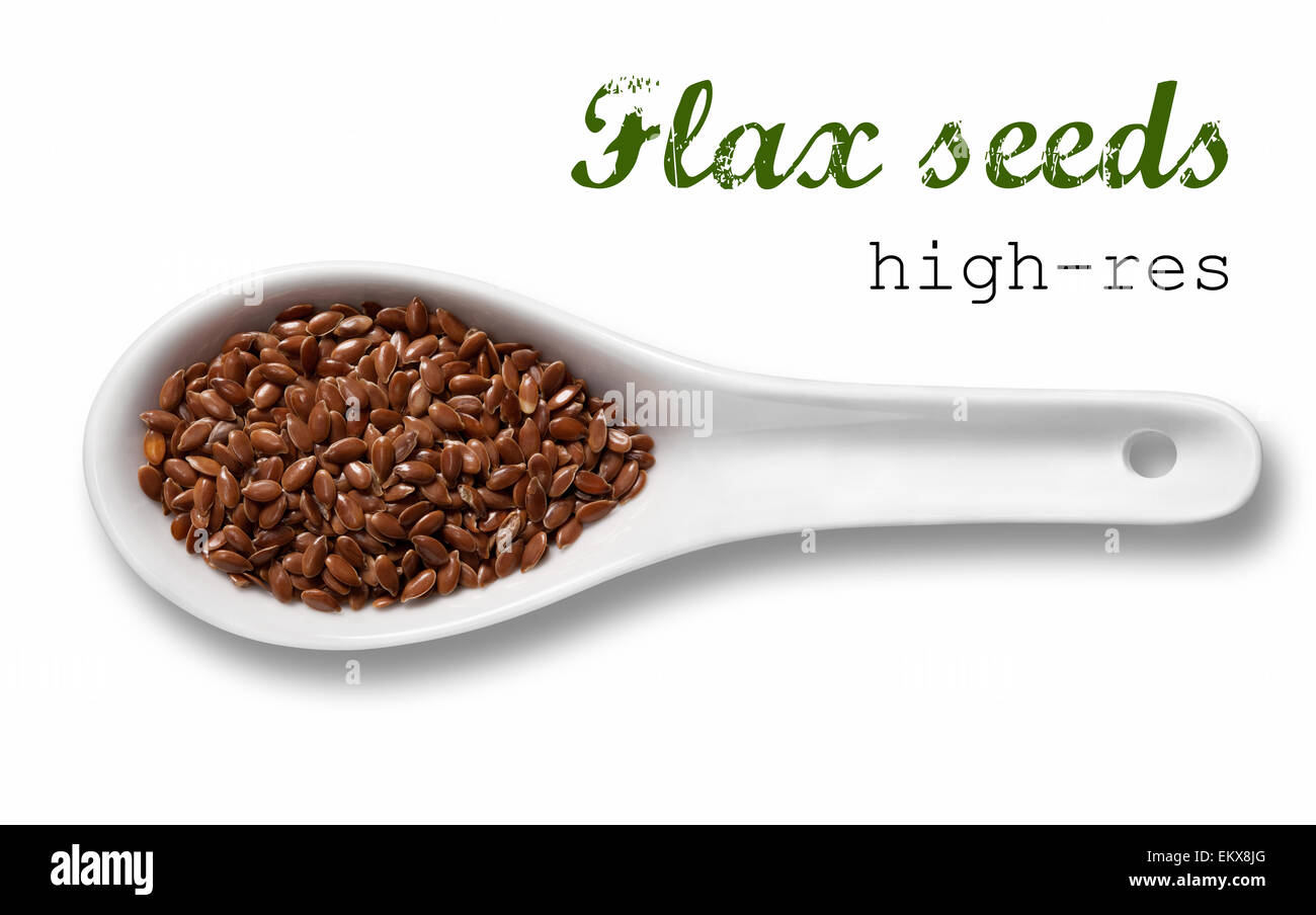 Flax seeds in white porcelain spoon / high resolution product photography of seed in white ...