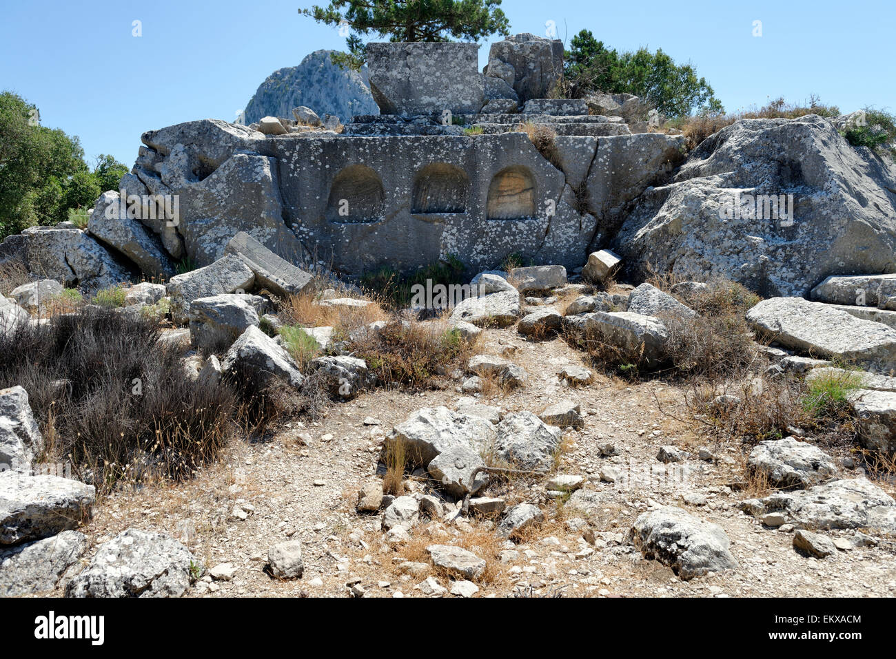 Three rock cut semicircular niches which were part of the heroon which ...