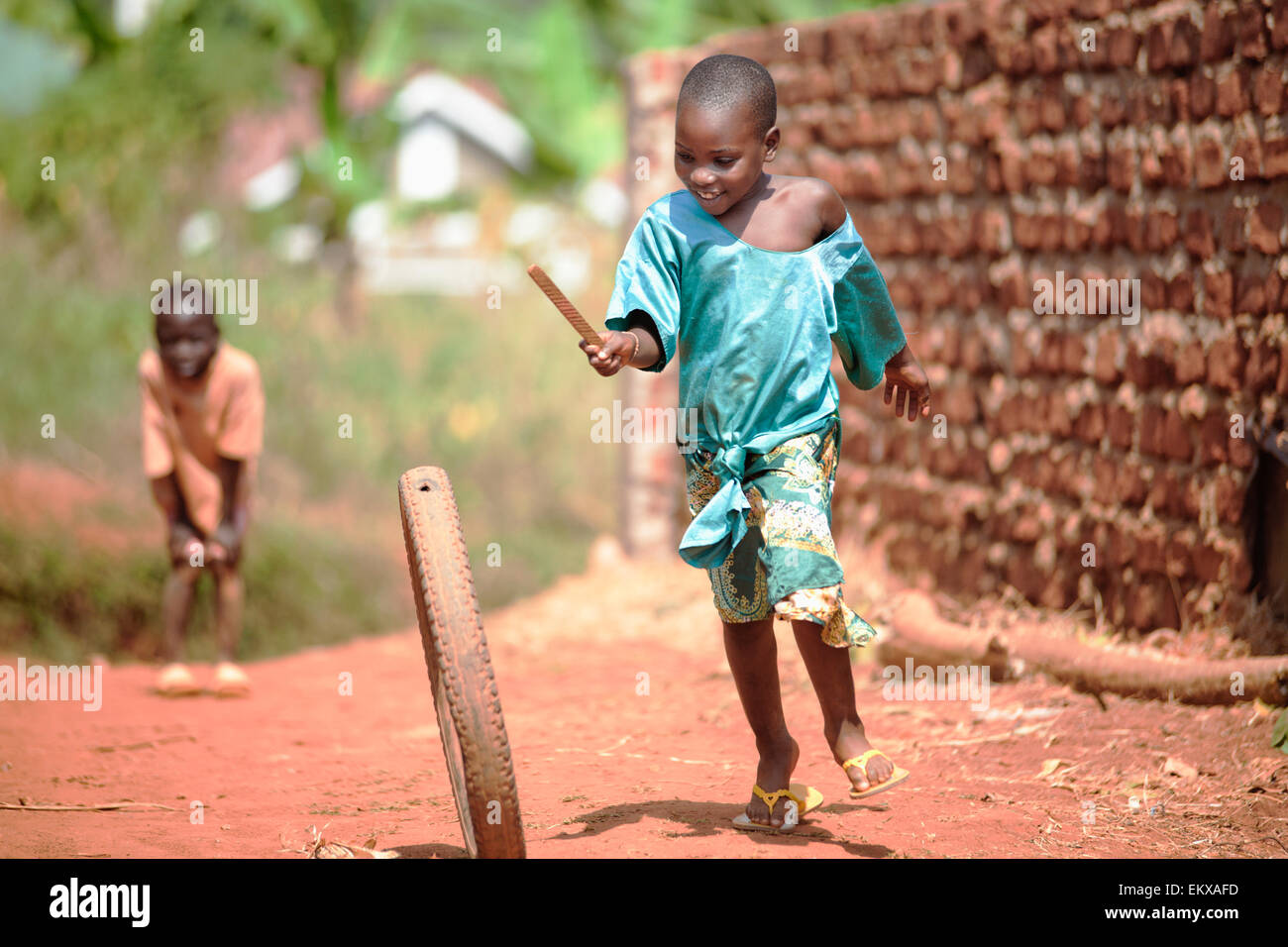 Ugandan Children Playing With Tire; Kampala Uganda Africa Stock Photo ...