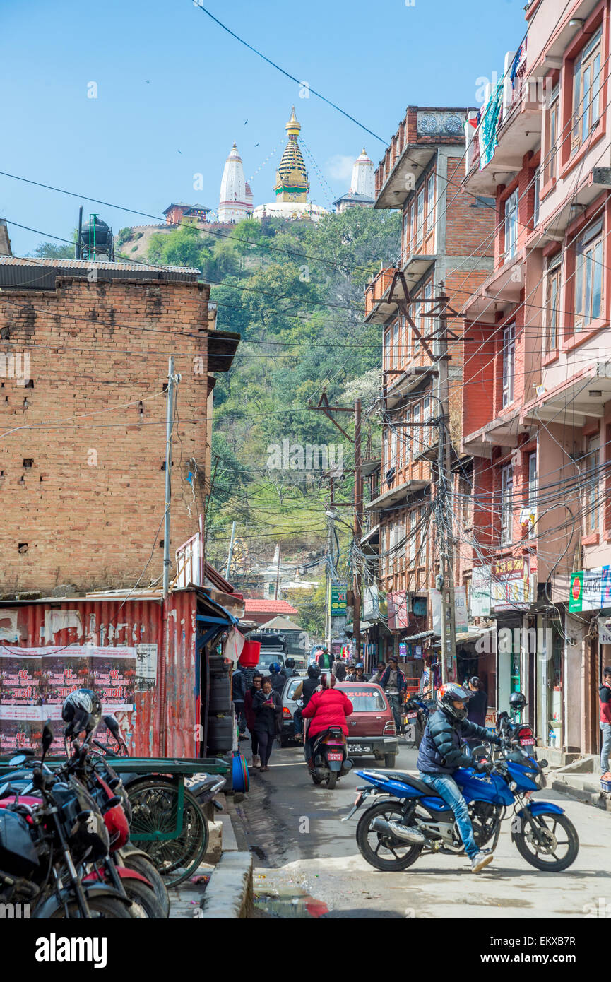 View of a street in Kathmandu, with Swayambhunath Monkey temple in the ...