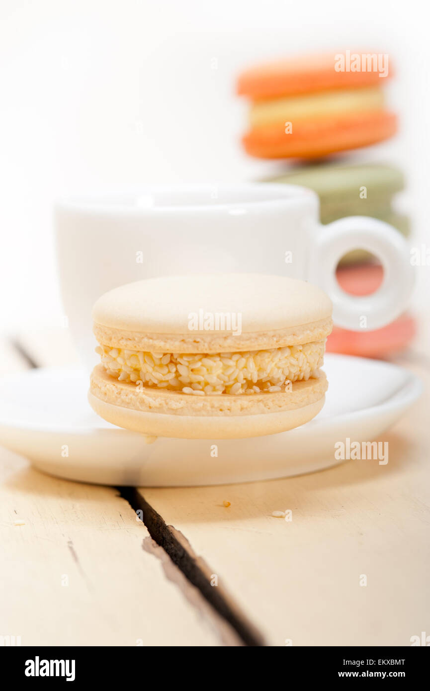 colorful macaroons with espresso coffee over white wood table Stock ...
