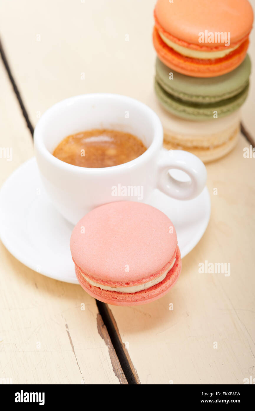 colorful macaroons with espresso coffee over white wood table Stock ...