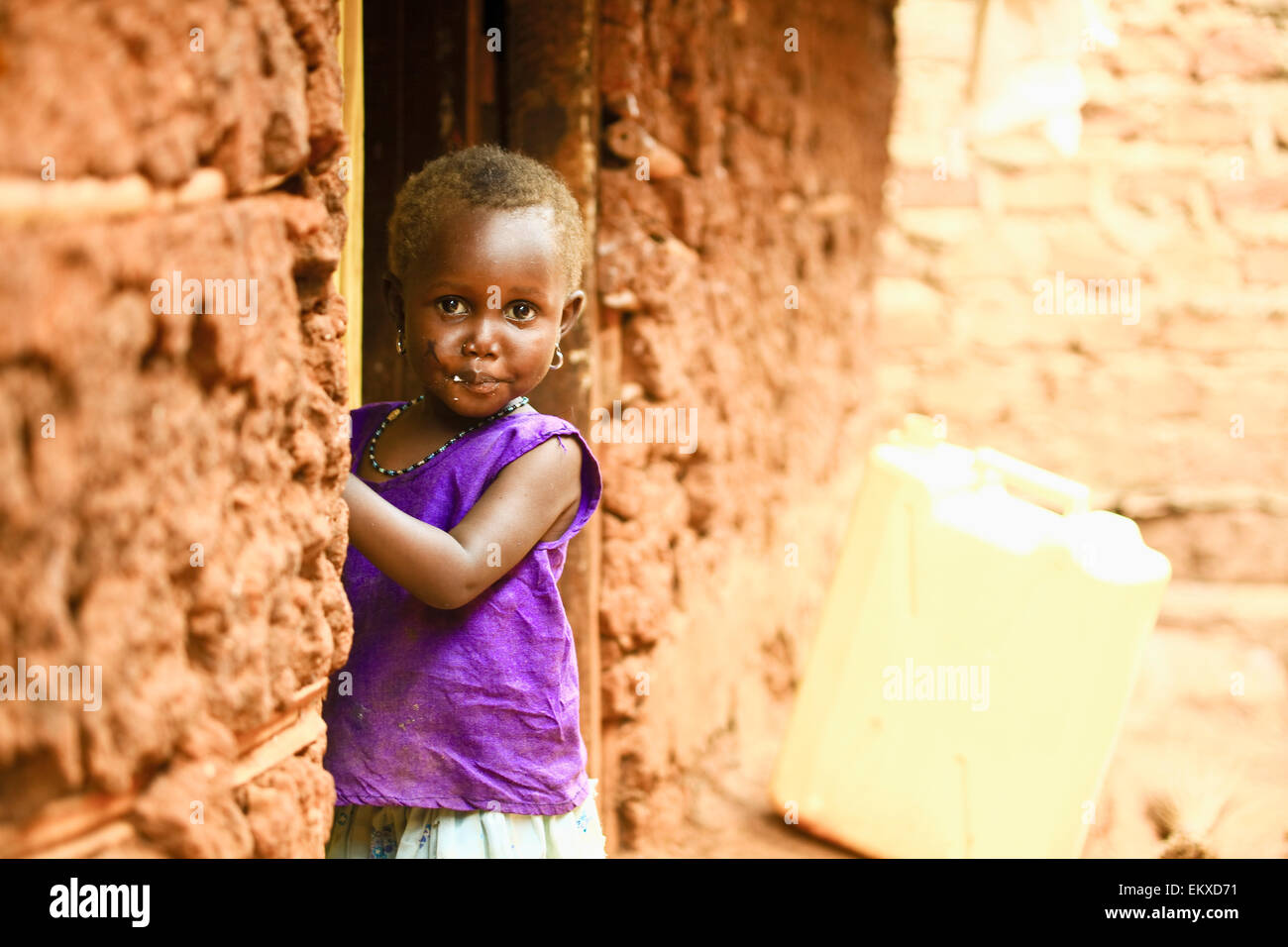A Young Girl Stands In A Doorway; Kampala Uganda Africa Stock Photo - Alamy